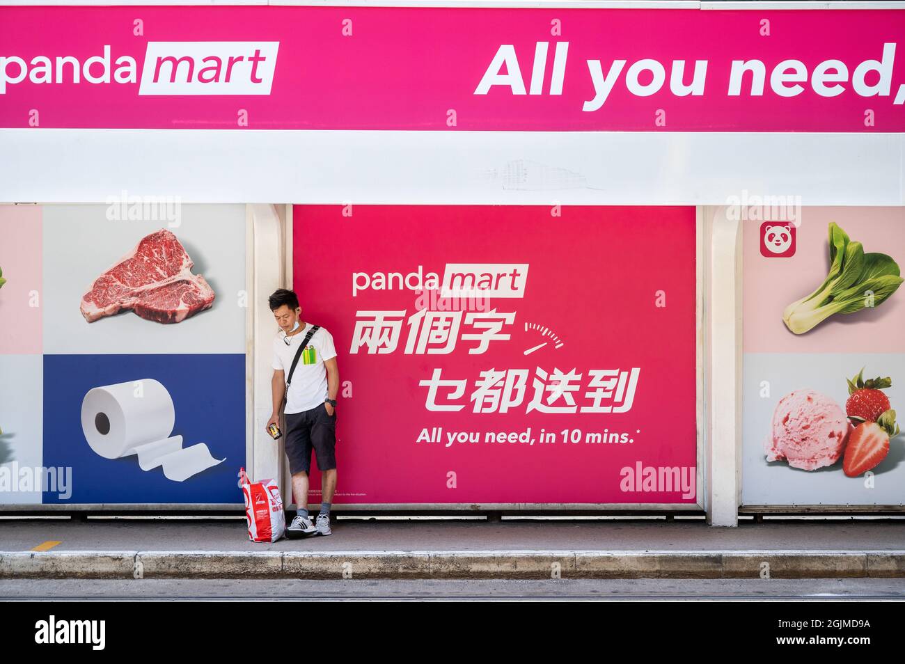 Hong Kong, China. 10th Sep, 2021. A commuter waits at a tram stop ...