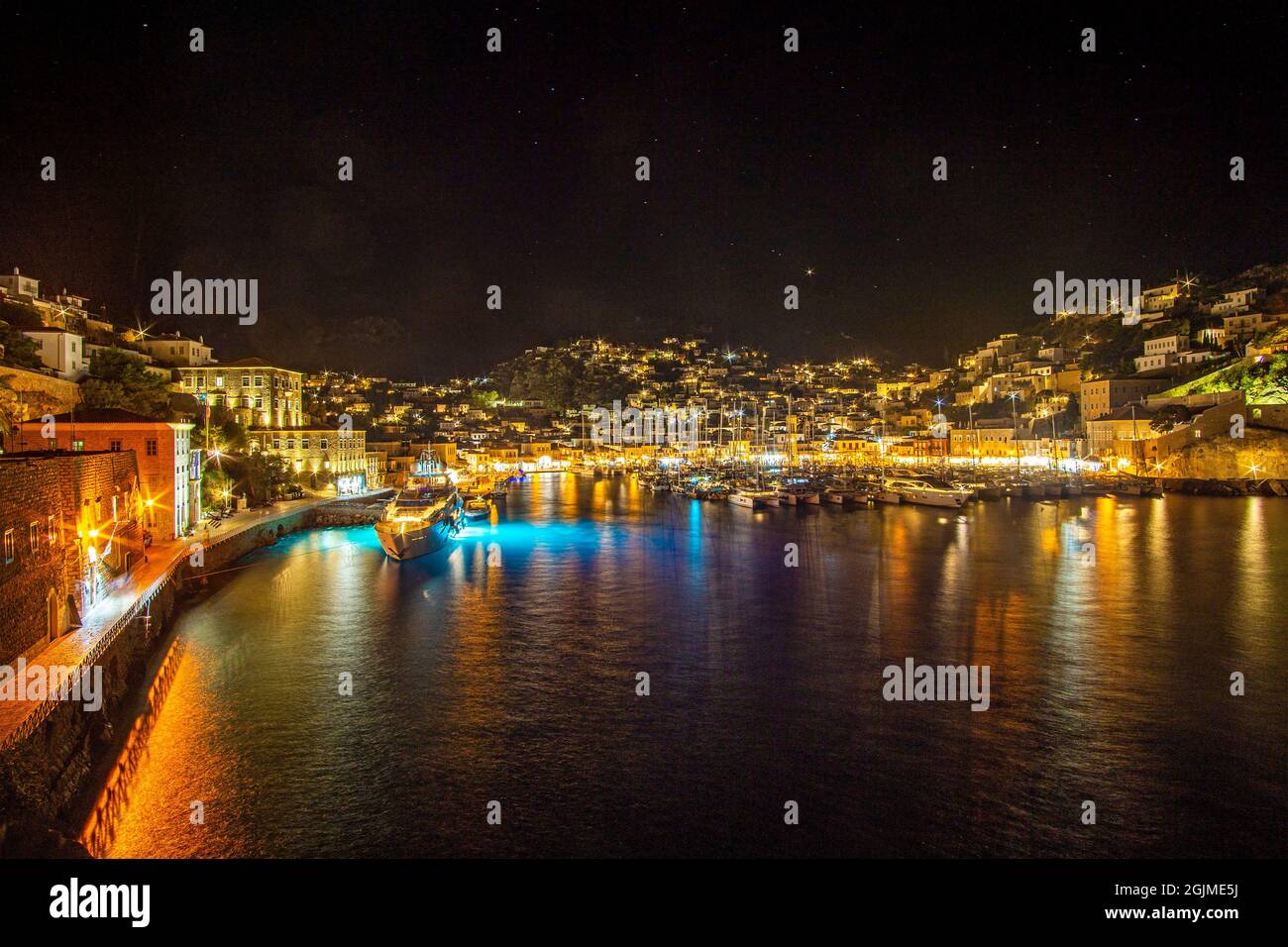 Night view from the picturesque port of Hydra island. The harbor or ...