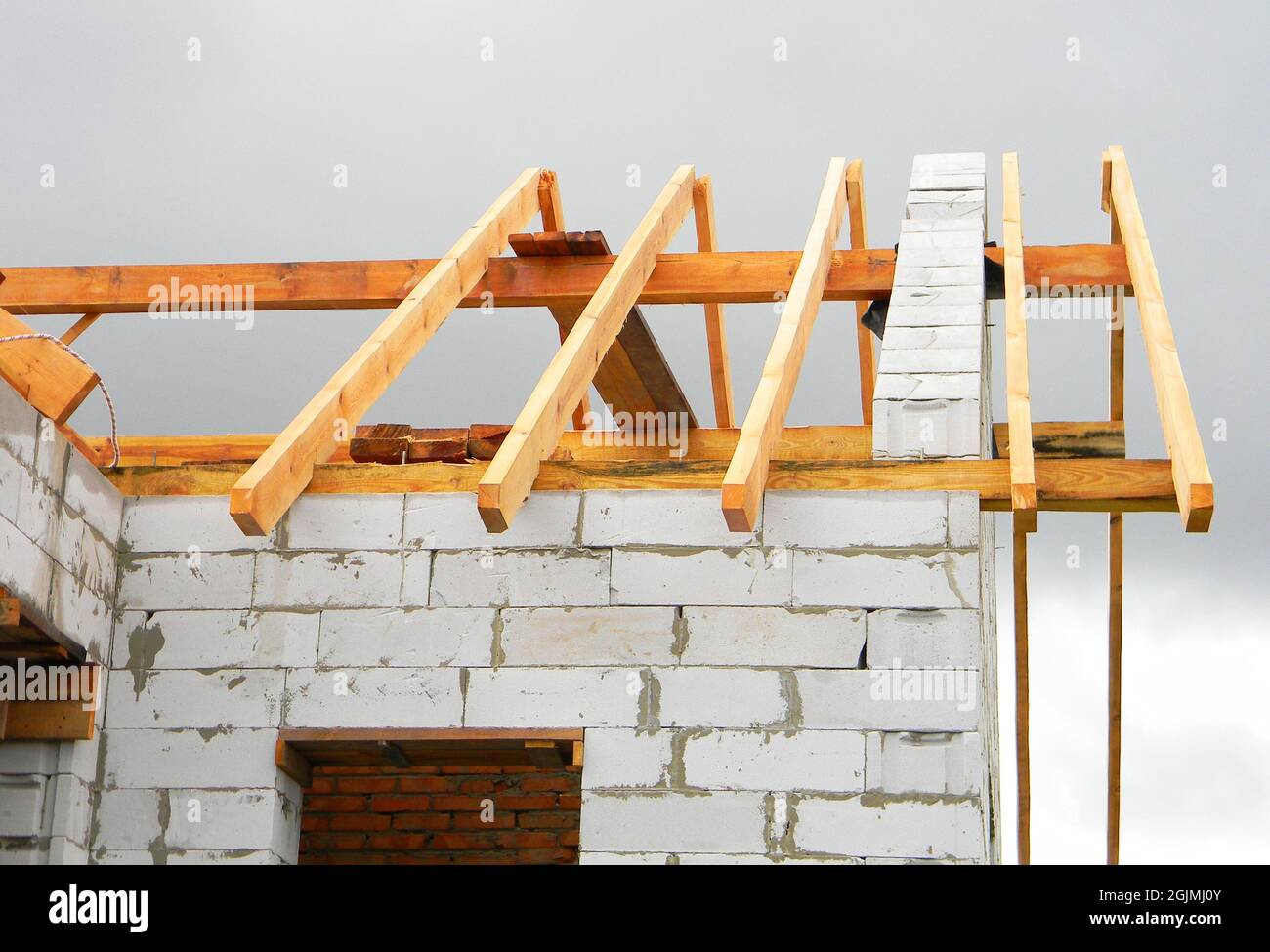 Timber roof trusses building. Wooden Roof Frame House Construction ...