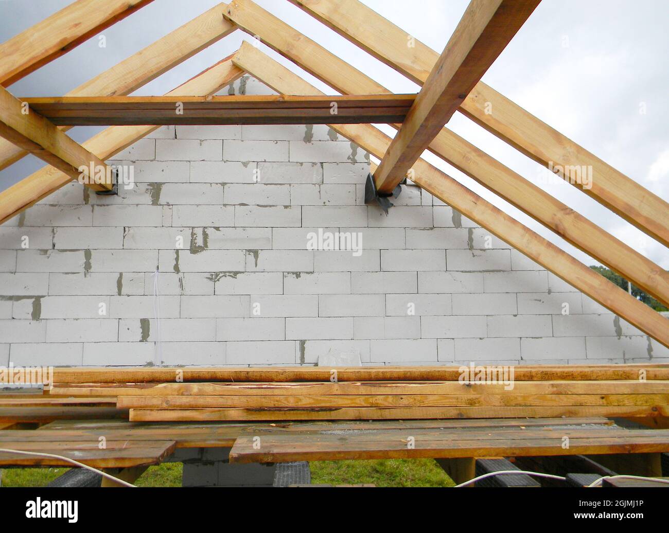 Covering roof wood trusses with antiseptic for wood and fire retardand ...