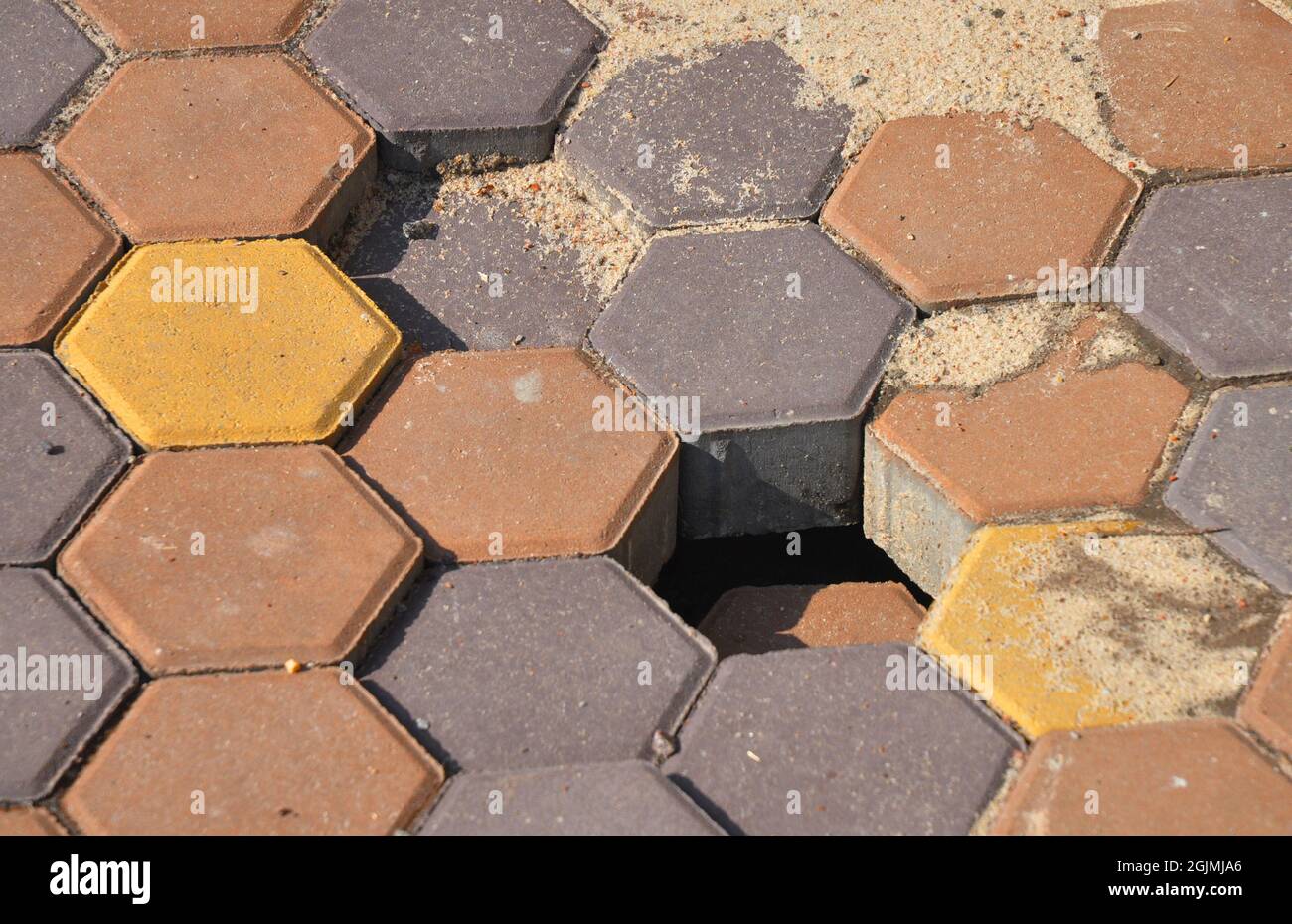 Bad Paving Job - Repair or Replace Pavement Stone Stock Photo - Alamy