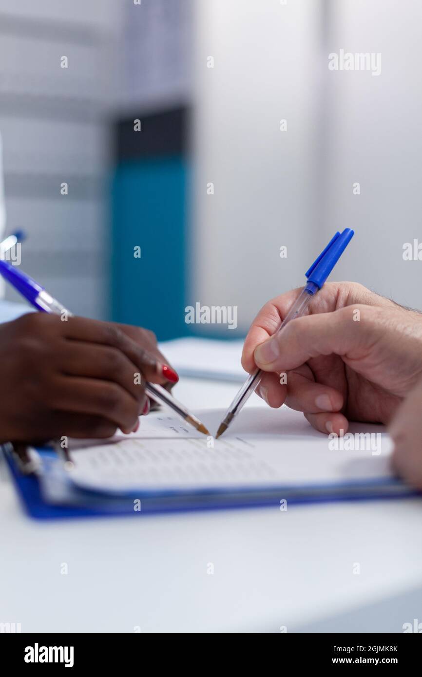 Elderly man signing papers hi-res stock photography and images - Alamy