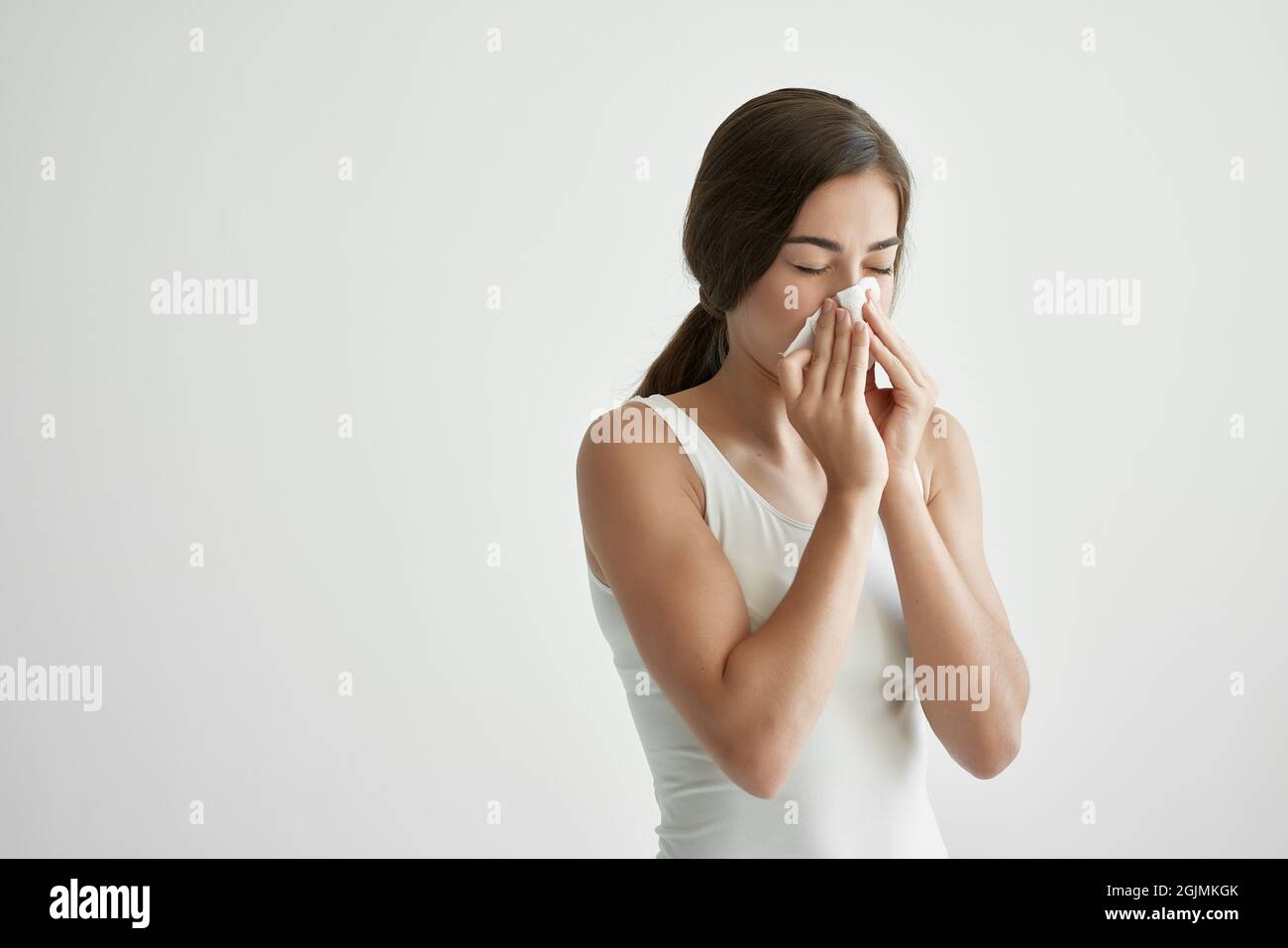 Woman wiping nose with hand hi-res stock photography and images - Alamy