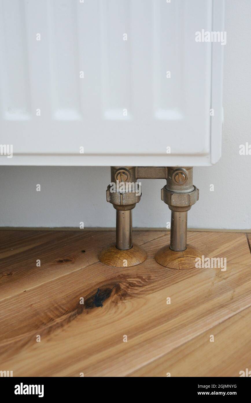 Install radiator for heating system with hiding pipes in the wooden ...