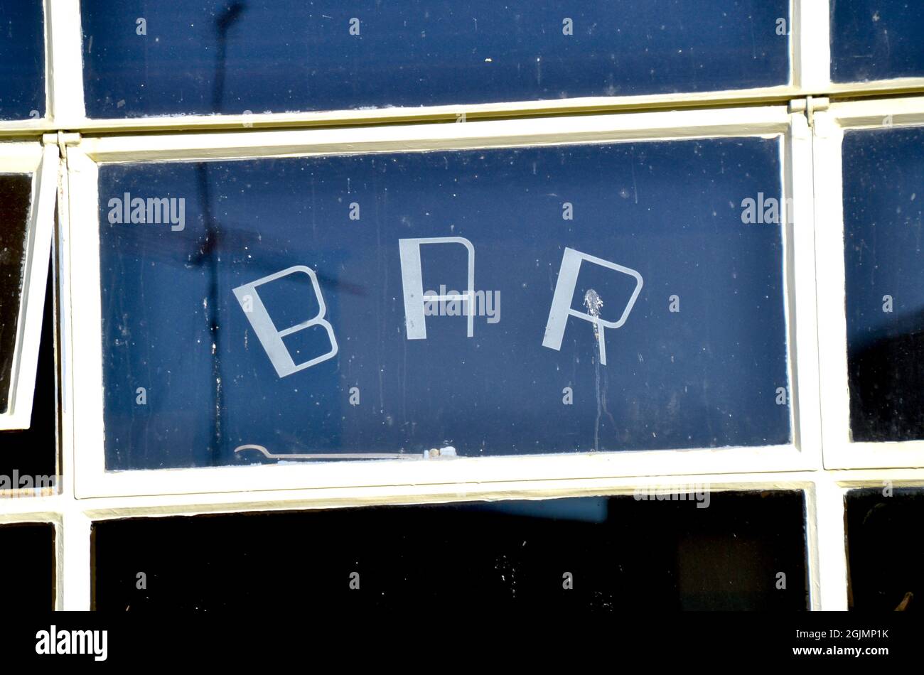 Old fashioned bar sign on the window in vintage retro art deco ...