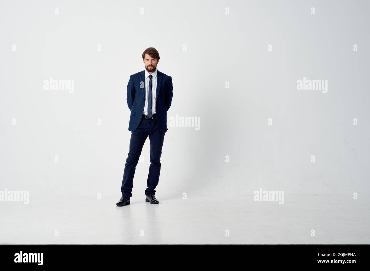 a man in a jacket and tie movement Jump Job career Stock Photo - Alamy