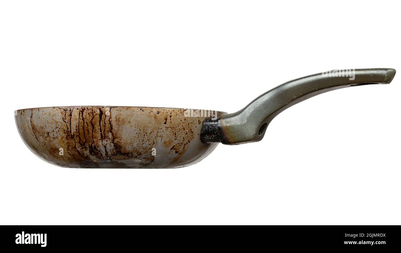 Old rusty frying pan on isolated with white background. File contains ...