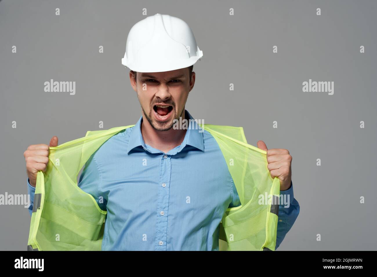 man in construction uniform Professional Job light background Stock ...