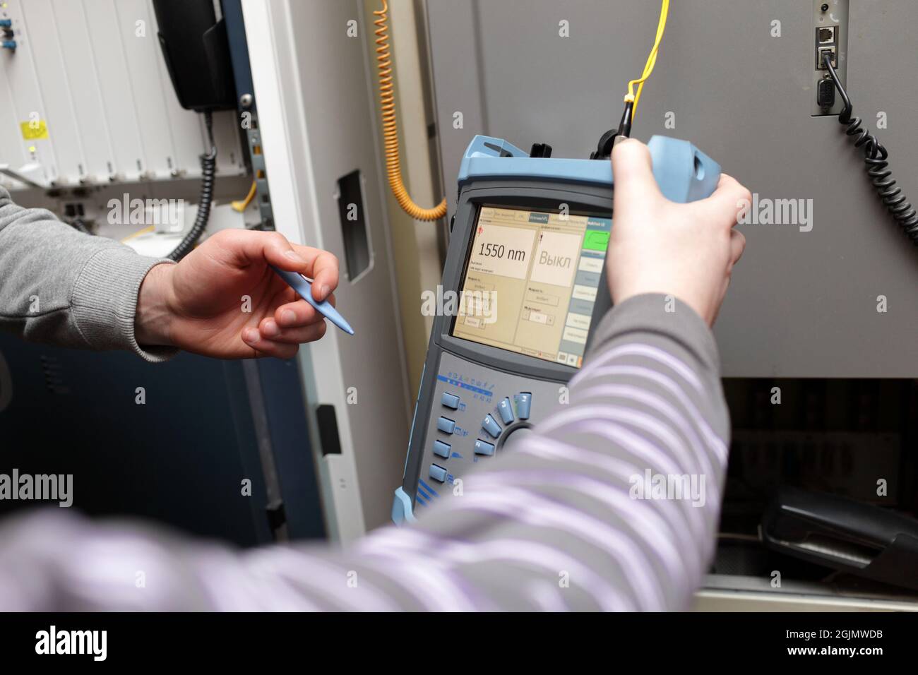 A maintenance technicians with reflectometer at a telecom site Stock ...