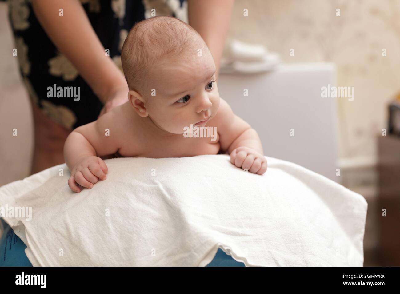 The baby fitness on a ball at home Stock Photo - Alamy