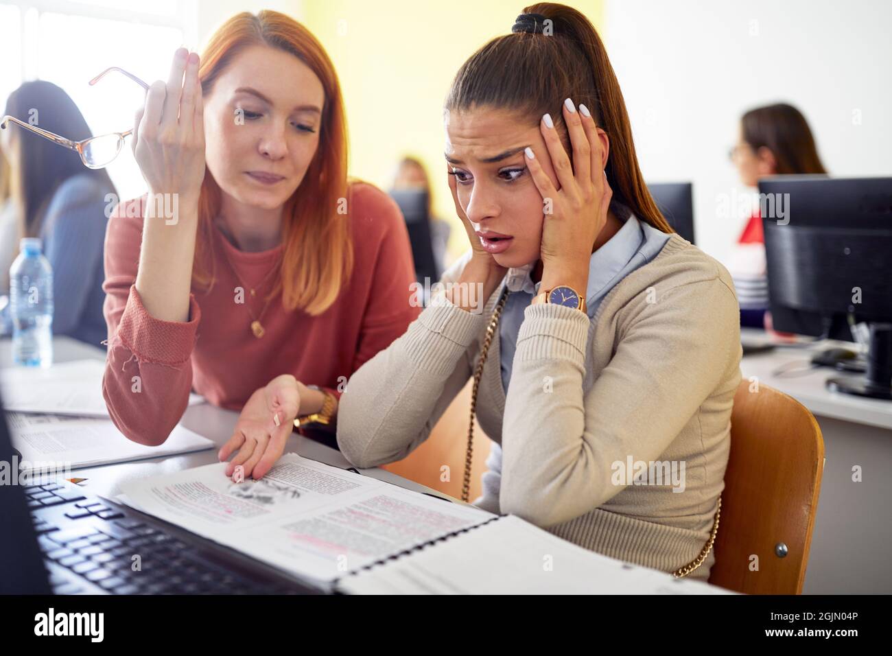 A female student confused by a new informatics lesson at the lecture in ...