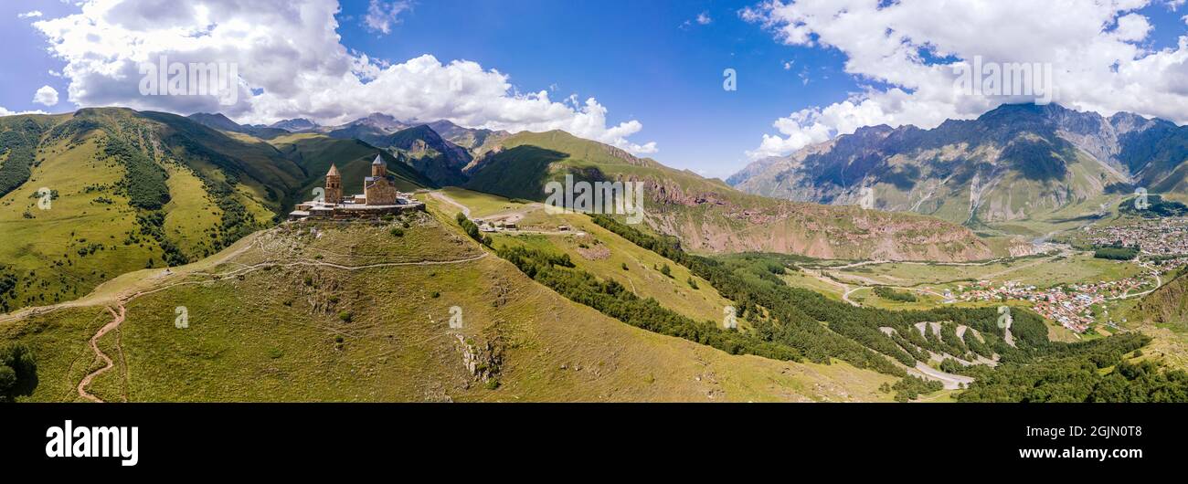 Aerial panoramic view of Gergeti Trinity Monastery on a beautiful ...