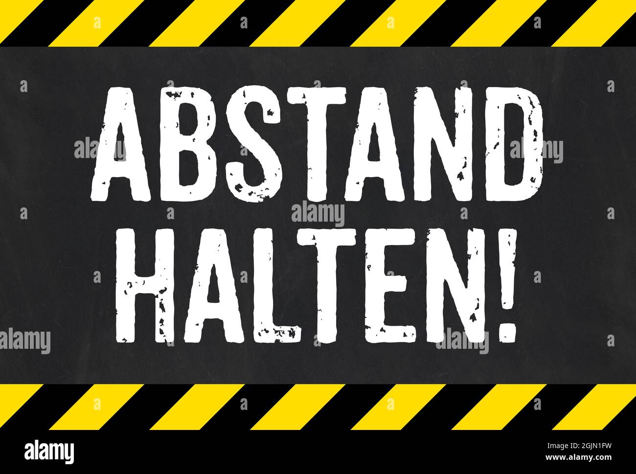 Sign with caution stripes - Keep distance in german - Abstand halten ...