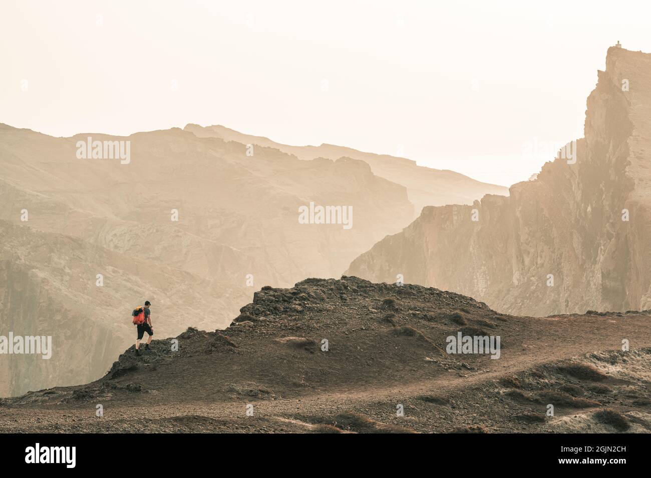 Hiker walking on mountain ridge, Madeira Stock Photo - Alamy