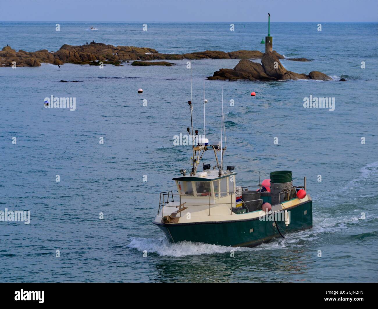Fishing boat returning to the port of Barfleur, a commune in the ...