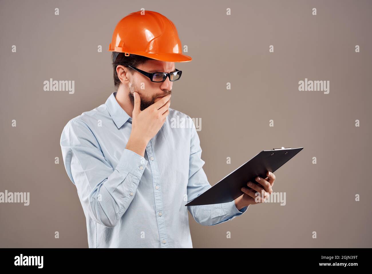 male engineer documents in hand and drawings success isolated ...