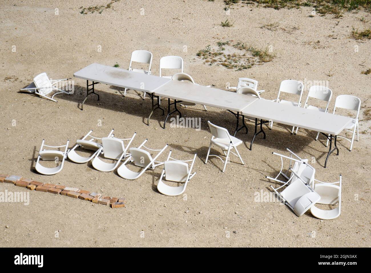 Overturned seats around a long table, Arles, Bouches du Rhône, Southern ...