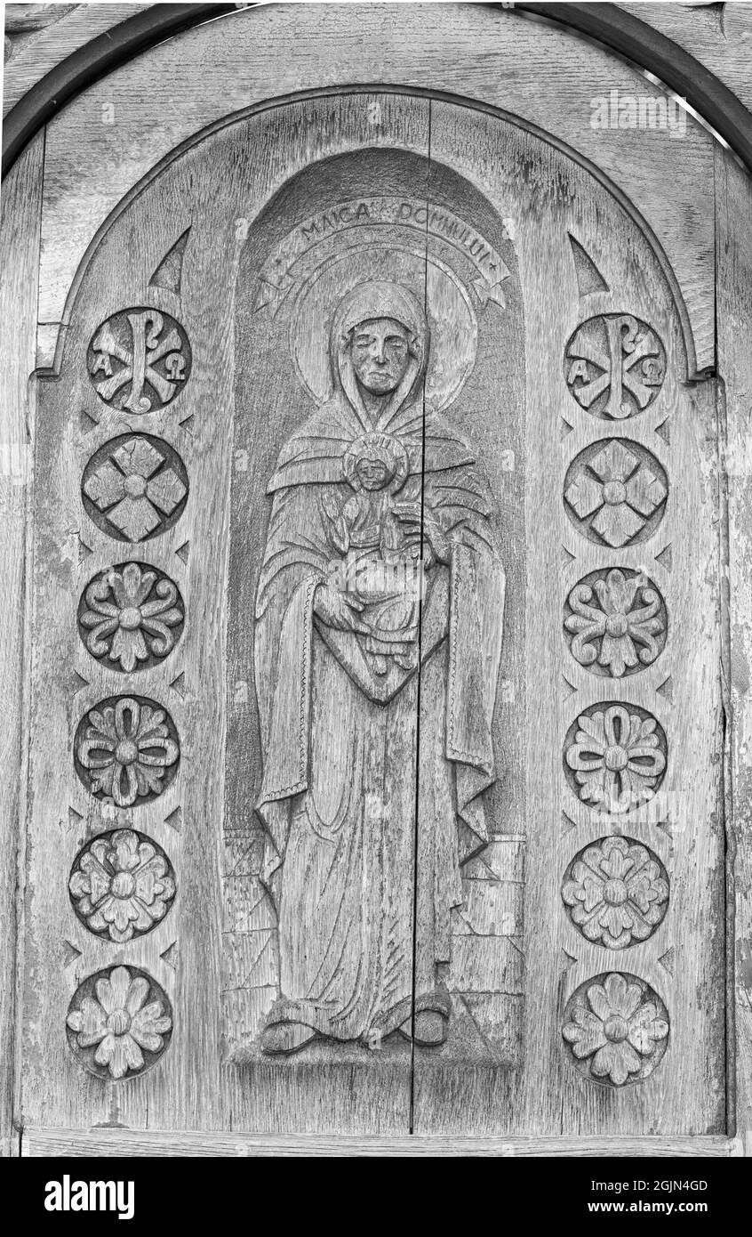 DERVENT, ROMANIA - Jul 28, 2021: An old wooden sculpture of the mother ...