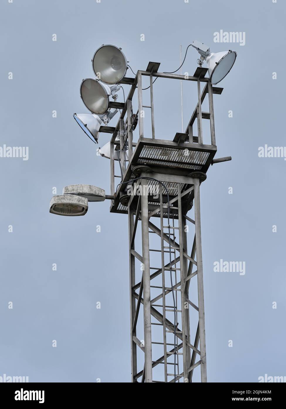 Six lamps on a high steel column with a ladder Stock Photo - Alamy