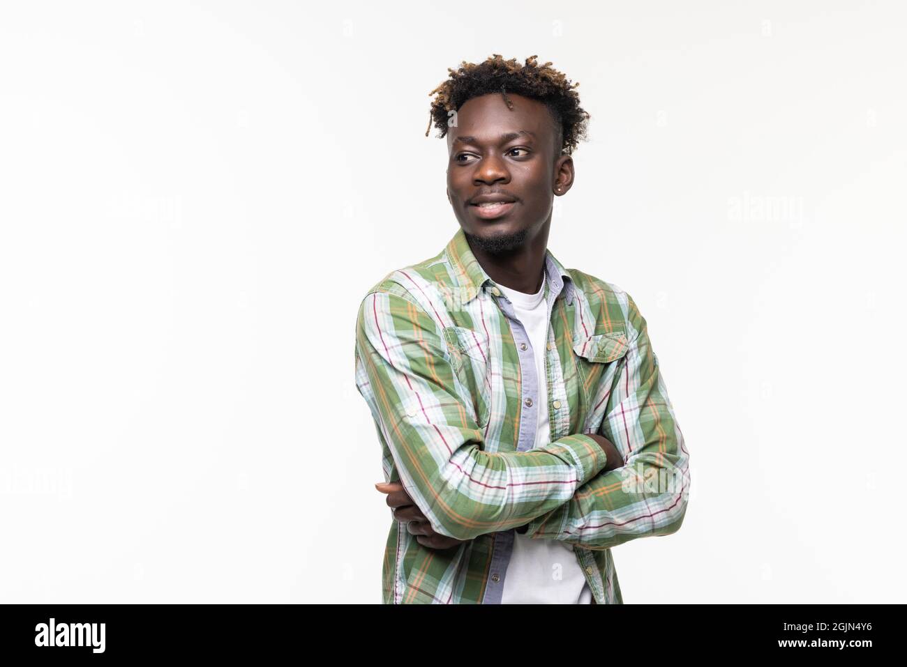 Smiling african man with crossed arms on white background Stock Photo ...