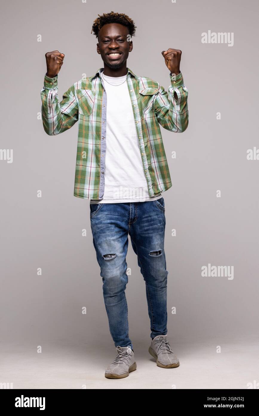 African man celebrating success isolated on white background Stock ...