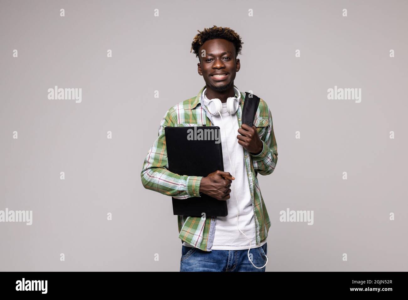 Happy african american student holding laptop on white Background Stock ...