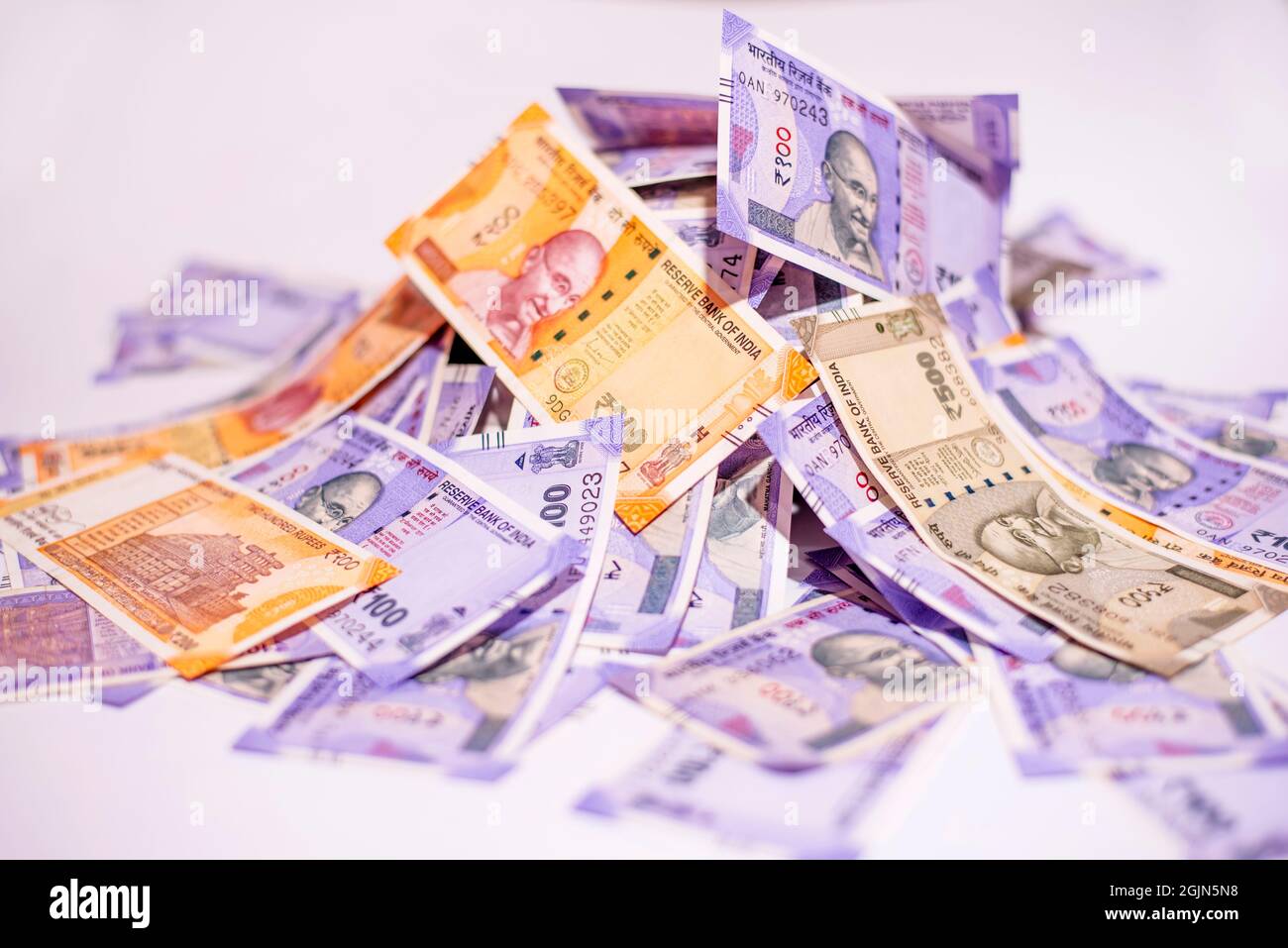Stack of Indian paper currency isolated background Stock Photo - Alamy