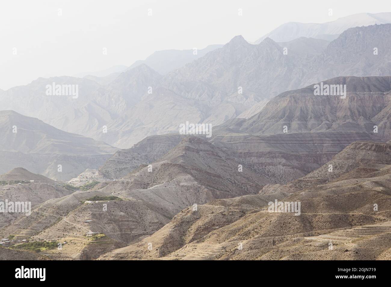 Misty mountain hills landscape. Layers of rocky mountains and hills in ...