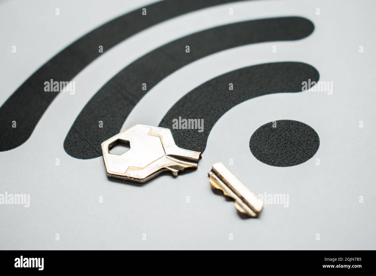 Closeup of a broken key on a white background with the wifi signal ...