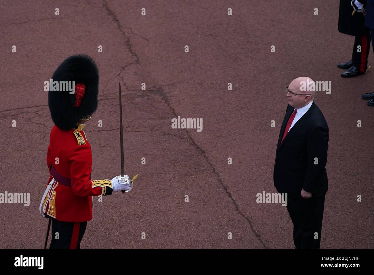 Acting Ambassador, Philip T Reeker, Charge d'Affaires, takes the salute ...