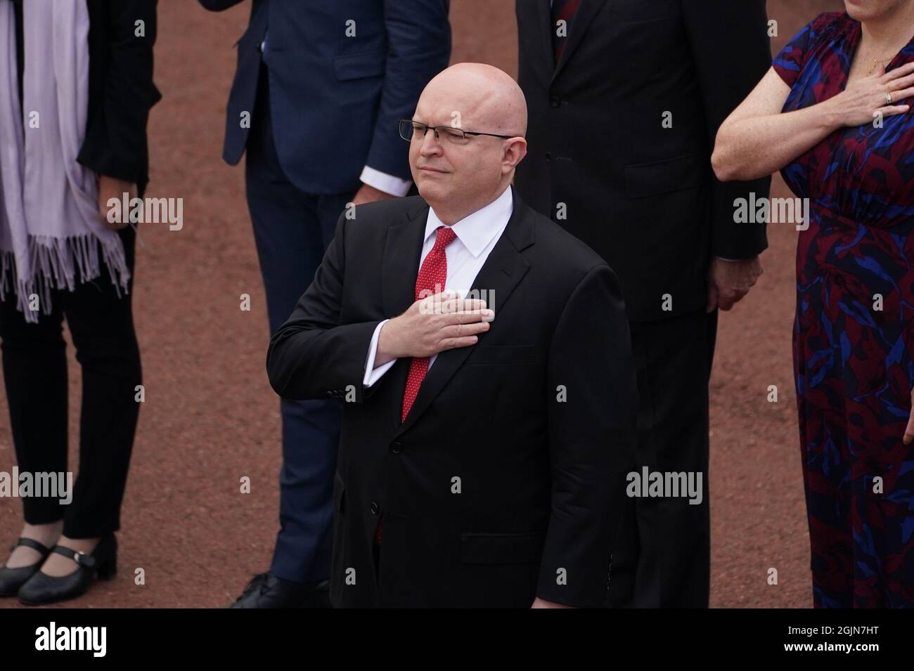 Acting Ambassador, Philip T Reeker, Charge d'Affaires, takes the salute ...