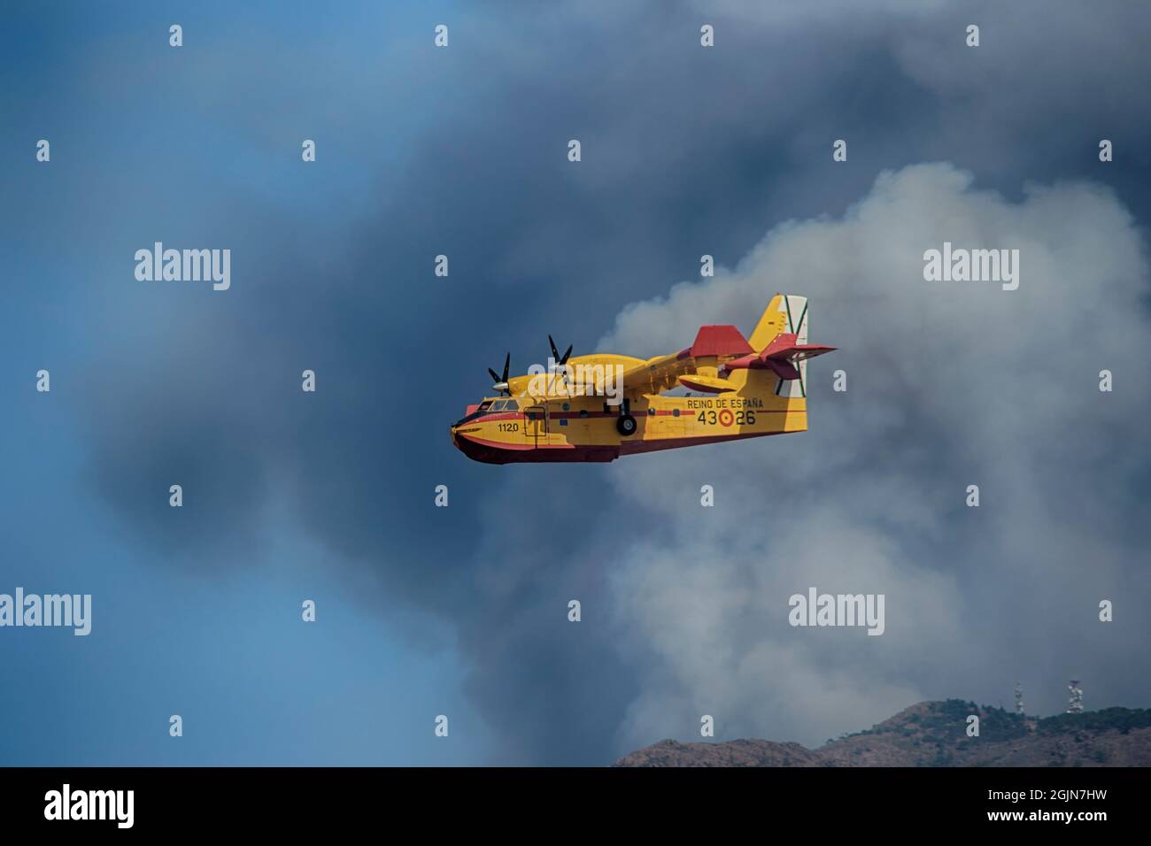 seaplane flying over a fire Stock Photo - Alamy