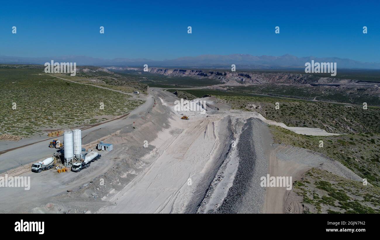 Aerial view of a construction site with a new long road being built ...