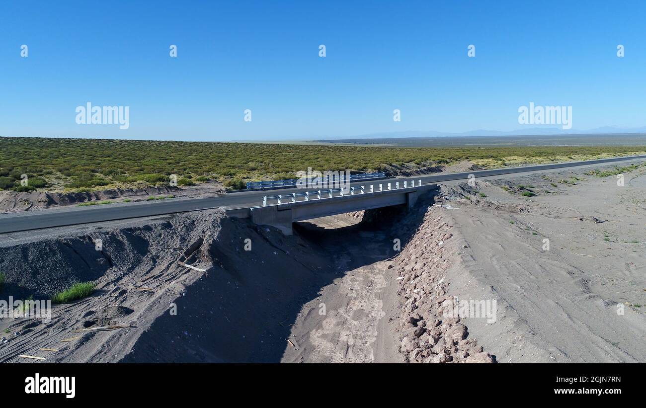Aerial view of a construction site with a new bridge being built over a ...