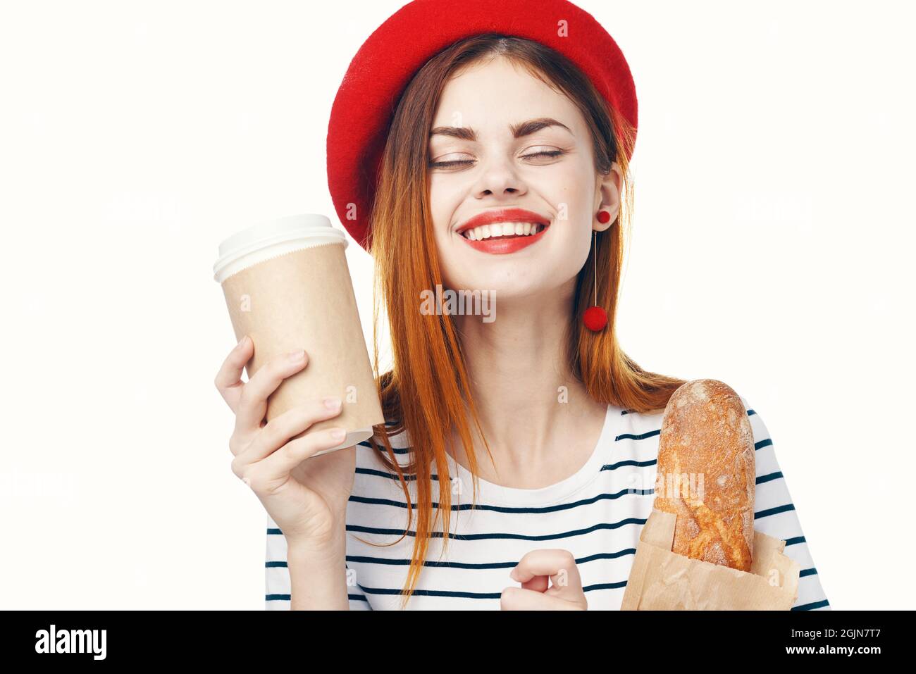 Frenchwoman in a red hat With a loaf of coffee and a blue background ...