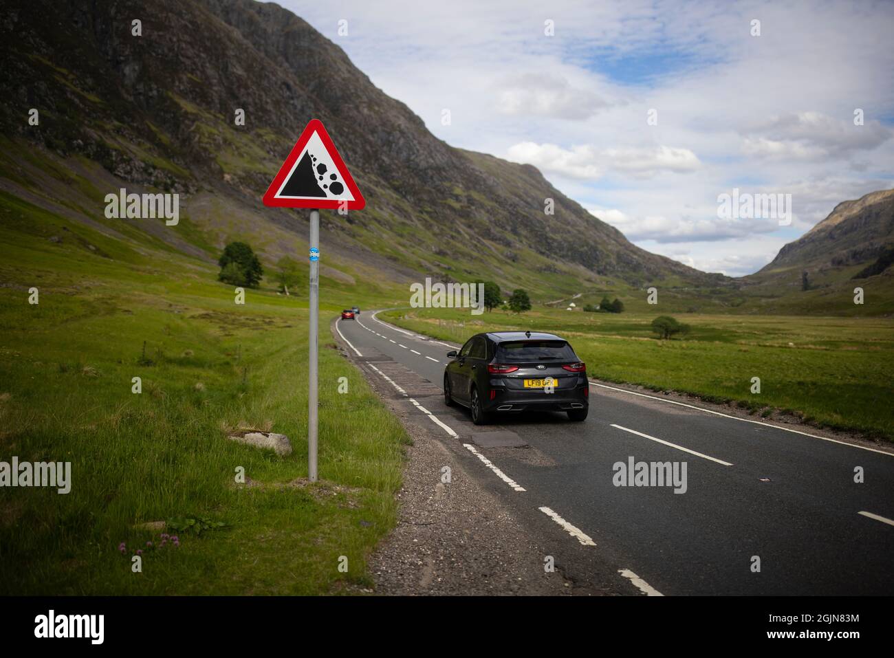 Risk of falling or fallen rocks ahead sign, Gelncoe, Scotland Stock ...