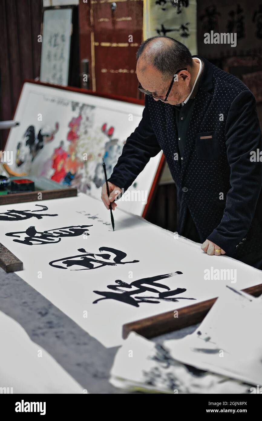 Chinese calligrapher practicing his calligraphic skills-Shuyuanmen ...