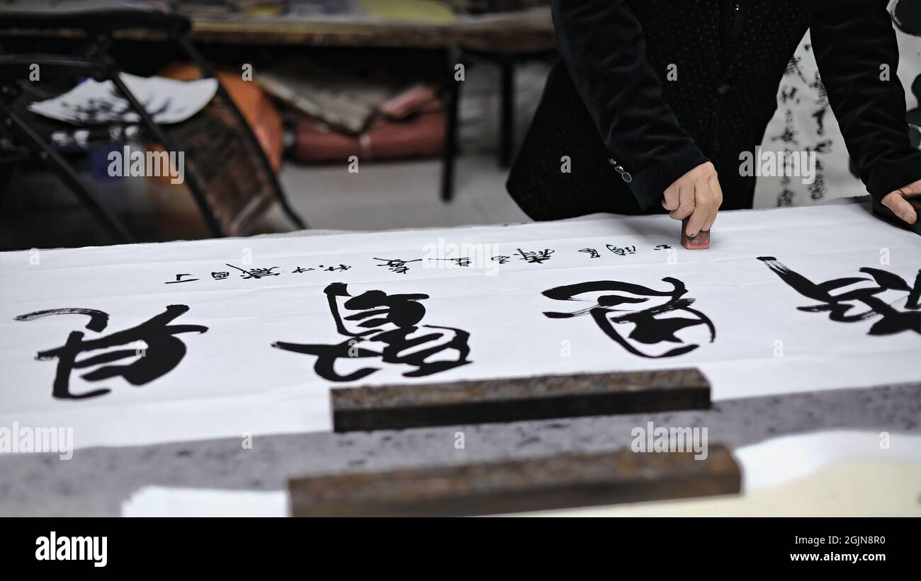 Chinese calligrapher practicing his calligraphic skills-Shuyuanmen ...