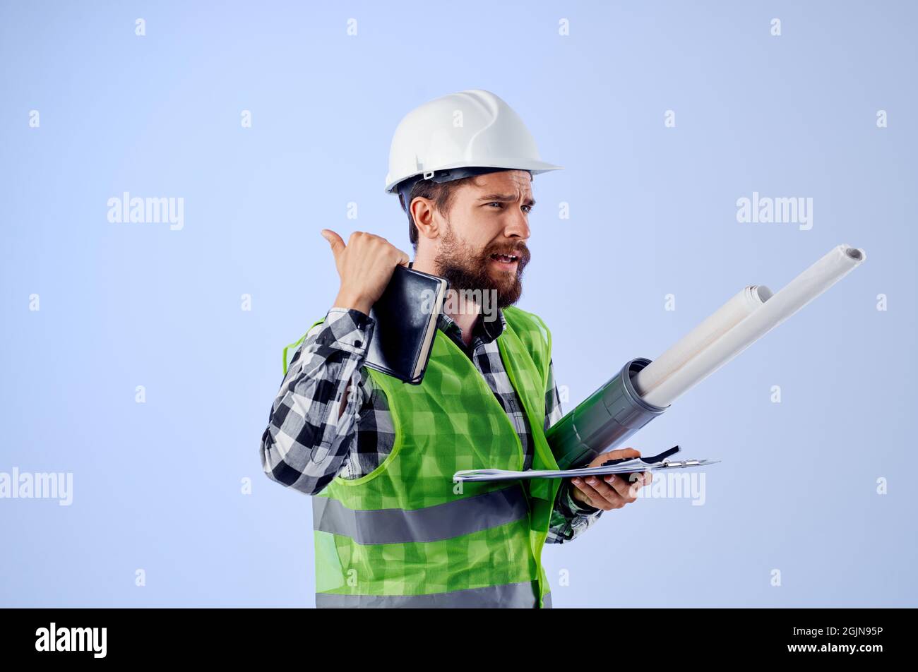 engineer with documents and drawings blueprints isolated background ...