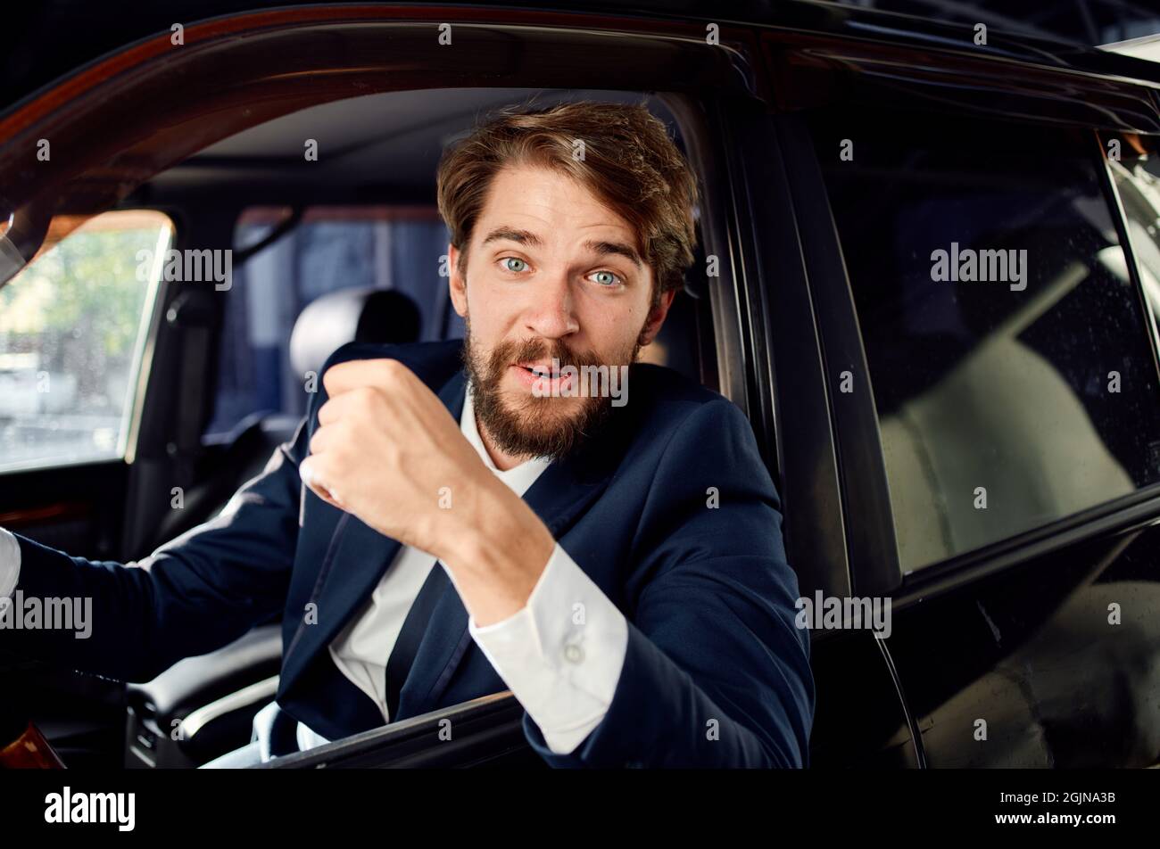 bearded man official passenger driver road success Stock Photo - Alamy