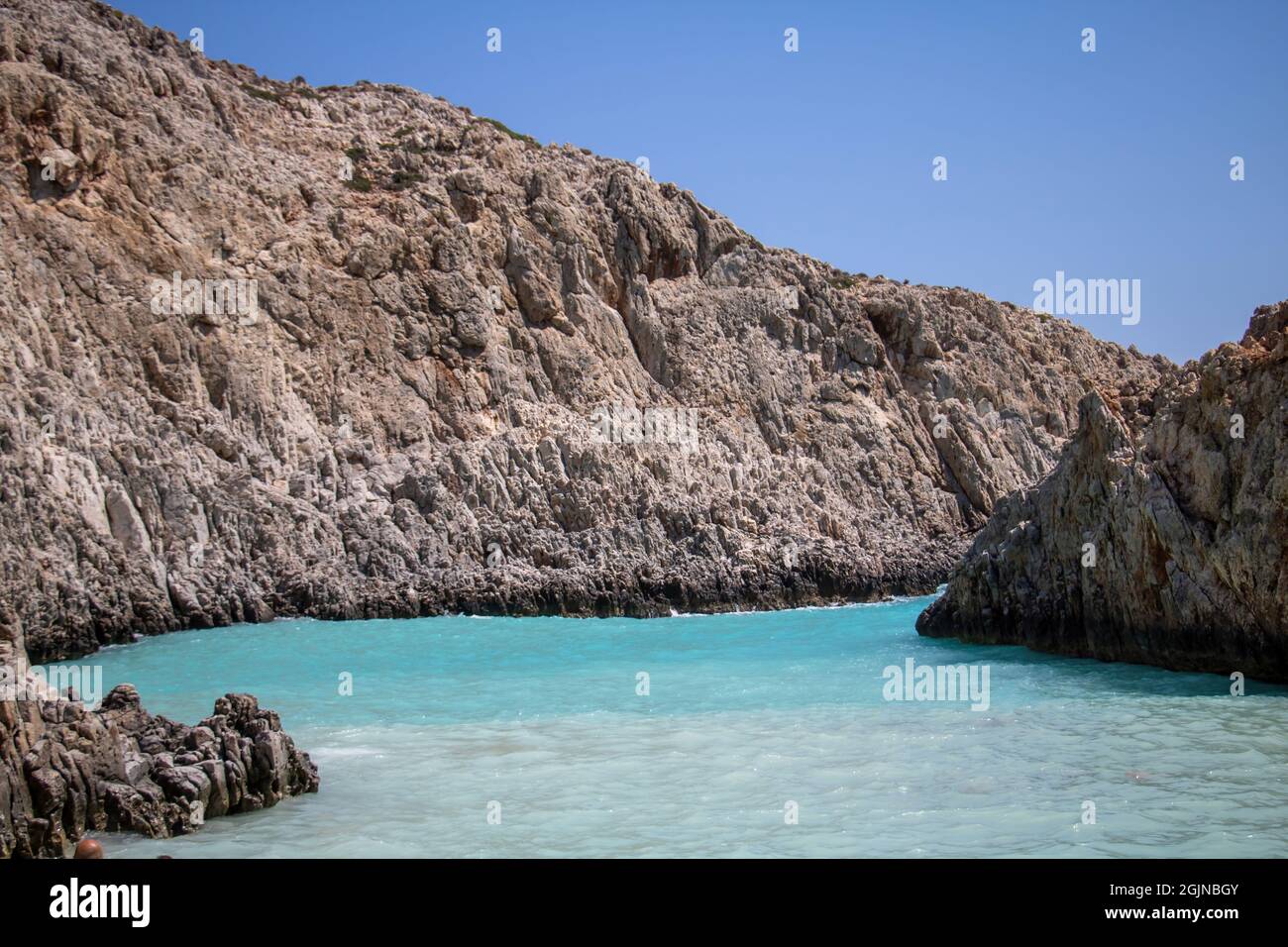 Sandy beach at Seitan Limania by a rocky inlet Stock Photo - Alamy