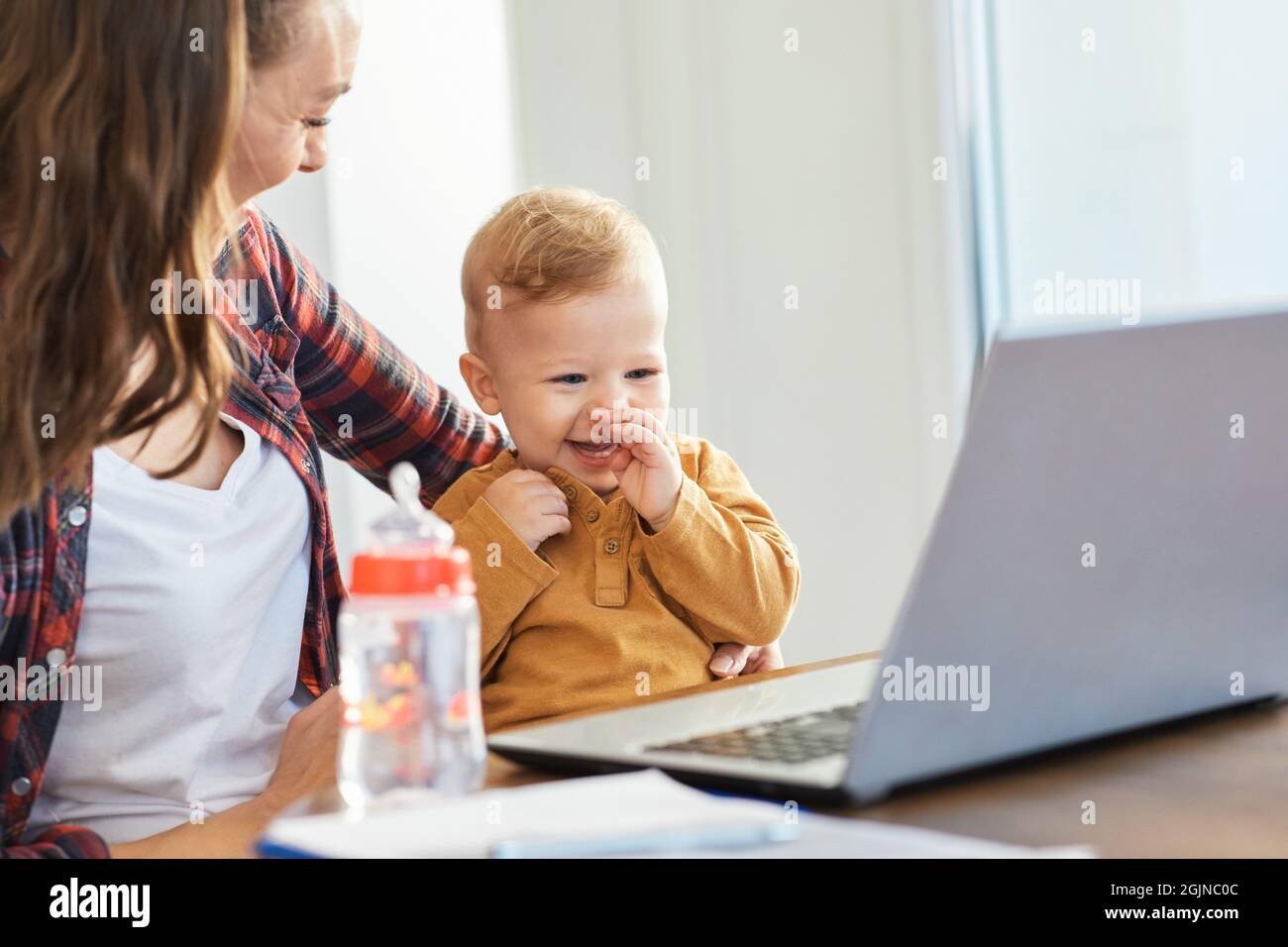 mother baby laptop computer child woman working business parent mom ...