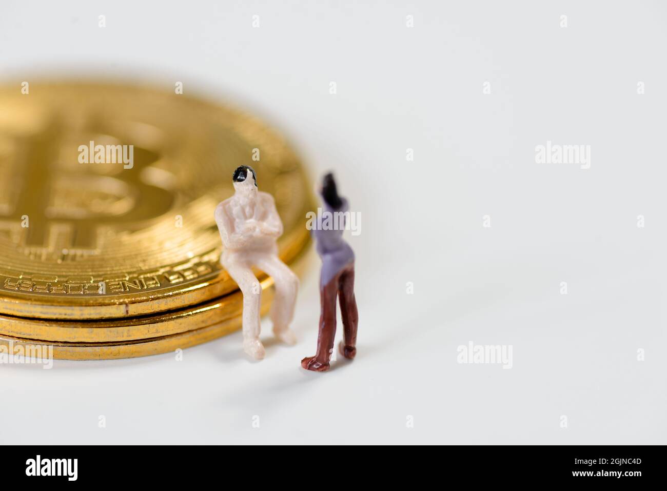 Human figure sitting on a crypto currency and talking with a another ...