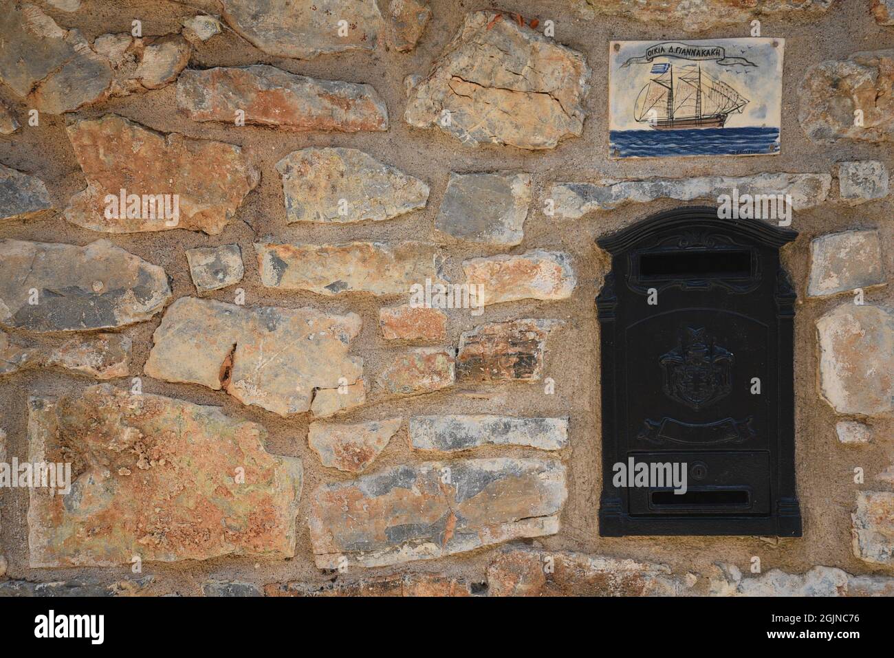 Traditional custom made cast iron mailbox and a hand painted glazed ...