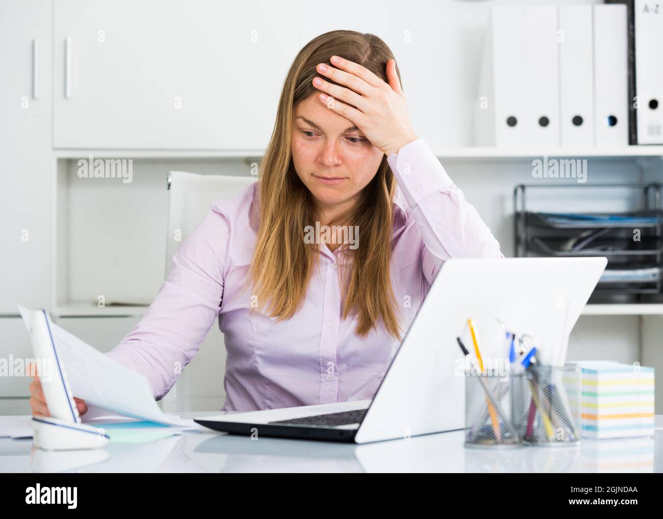 Woman having problem in office Stock Photo - Alamy