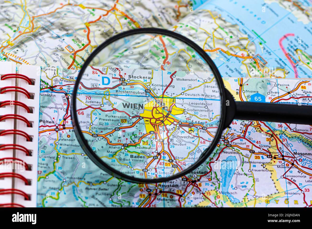 map of Vienna in Austria through magnifying glass, concept of planning ...