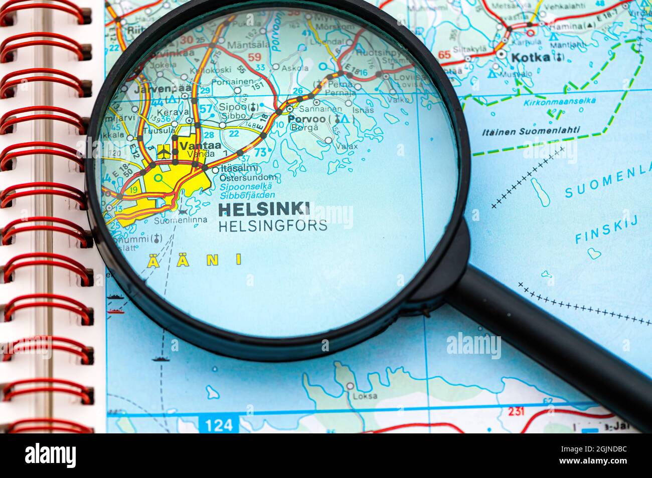 map of Helsinki in Finland through magnifying glass, concept of ...