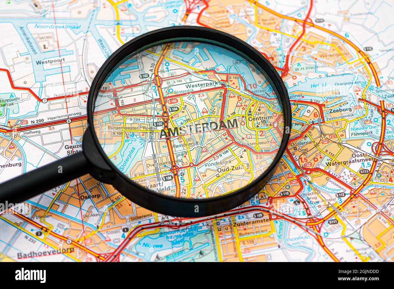 map of Amsterdam in Netherlands through magnifying glass, concept of ...