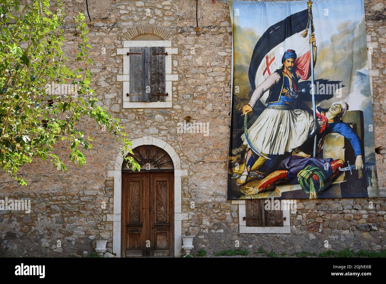 Old stone built public building with the 1821 national heroes poster on ...