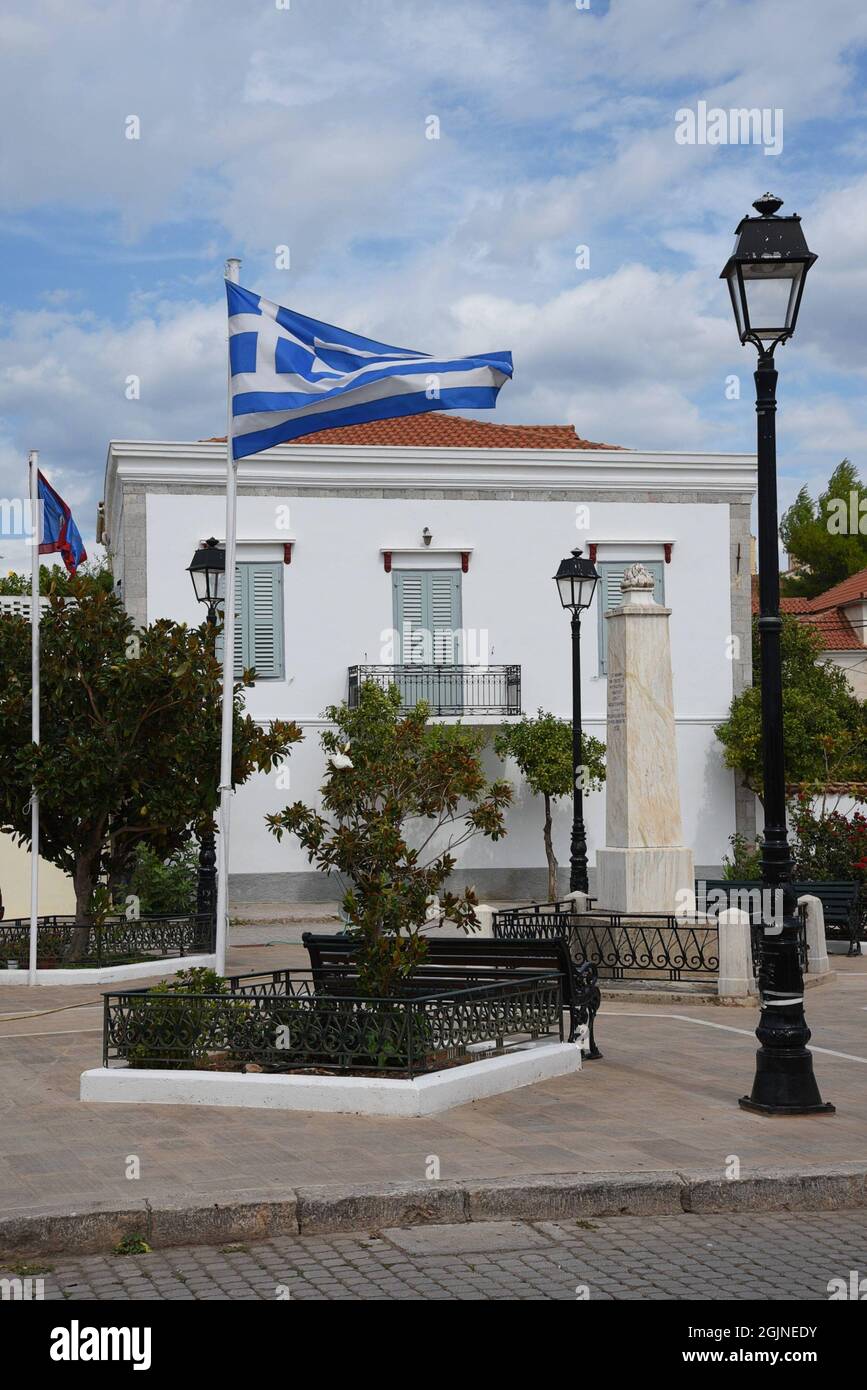 Neoclassical house with a weaving Greek flag in the foreground on the ...